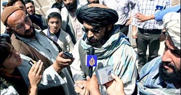 Taliban Says It Will Release 2 Hostages - CBS News