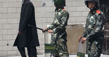 Chinese Police Enforce Order after Riots - CBS News