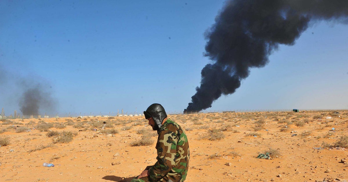 The Qaddafi regime versus "gangs" - CBS News