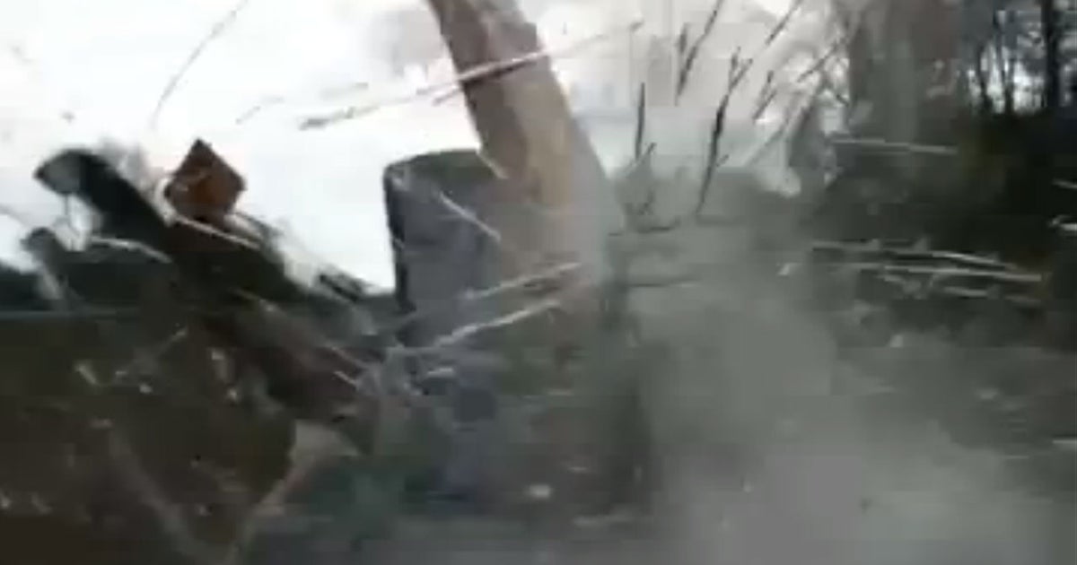 Shocking: 2x4 slams through car window on highway - CBS News