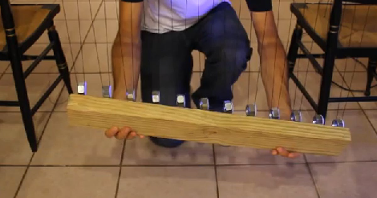 "Pendulum wave effect" shown using black light and music - CBS News