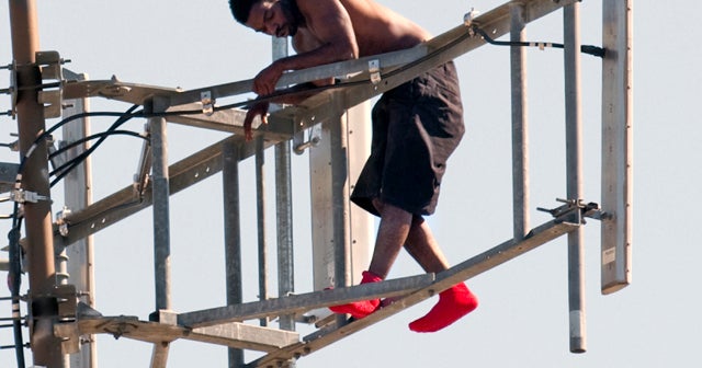 Man on tower takes police standoff to 5th day - CBS News