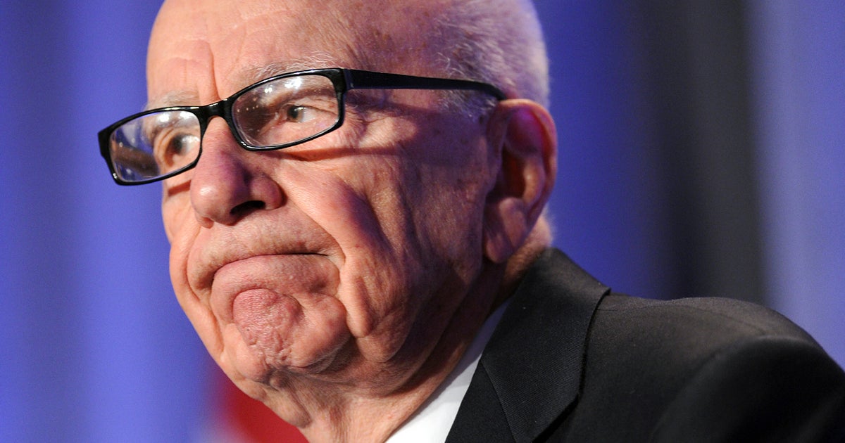 News International settles 9 phone hacking suits - CBS News