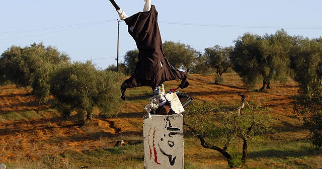 Qaddafi buried in secret location, officials say - CBS News