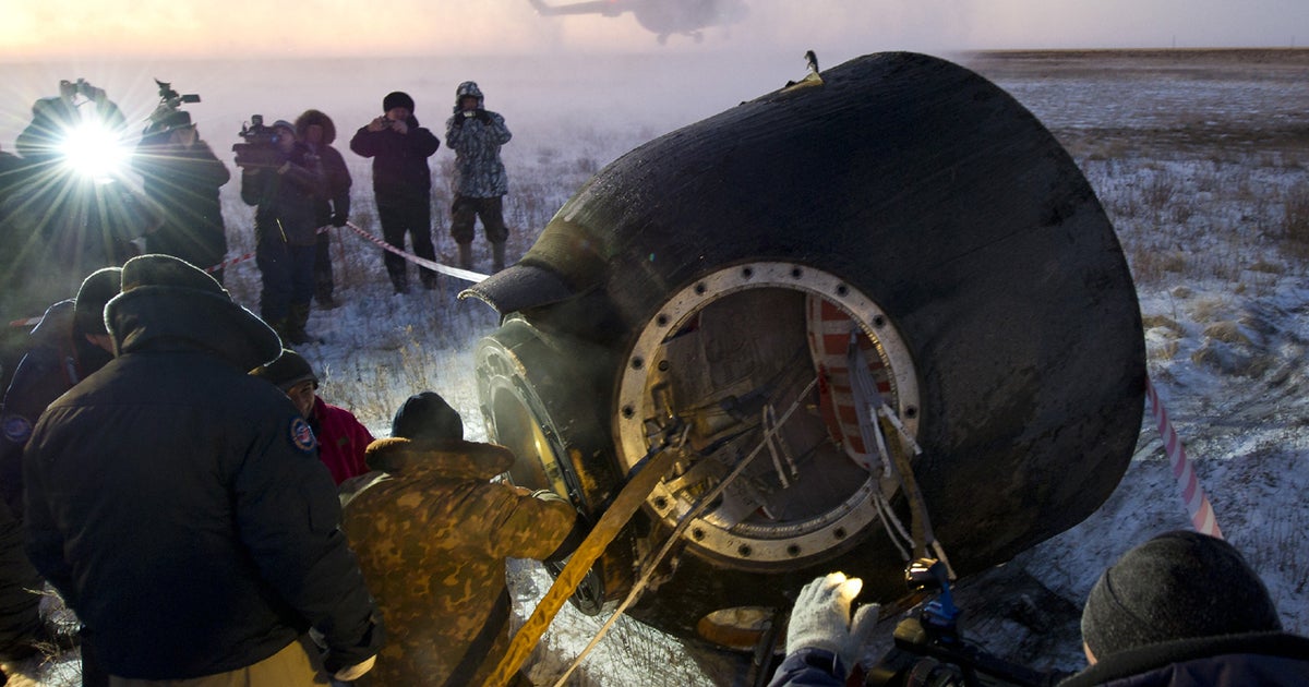 Soyuz returns to Earth with crew of 3 - CBS News