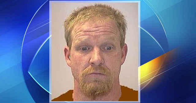 Missing man found hanging from highway billboard - CBS News