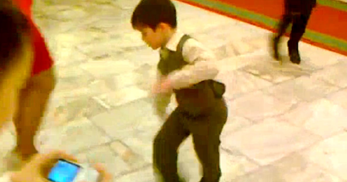 Watch this young boy just tear up the dance floor - CBS News