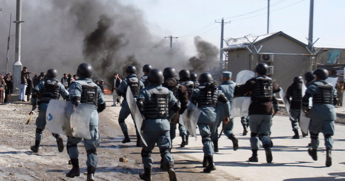 Afghan cops open fire on anti-U.S. protesters - CBS News