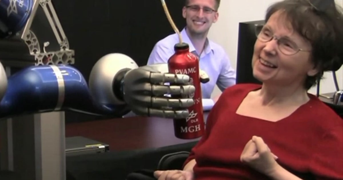 Quadriplegic woman uses brain to drink coffee with help from robotic ...