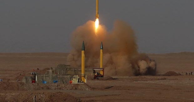 Iran test-fires missiles, sinks warship-sized target - CBS News