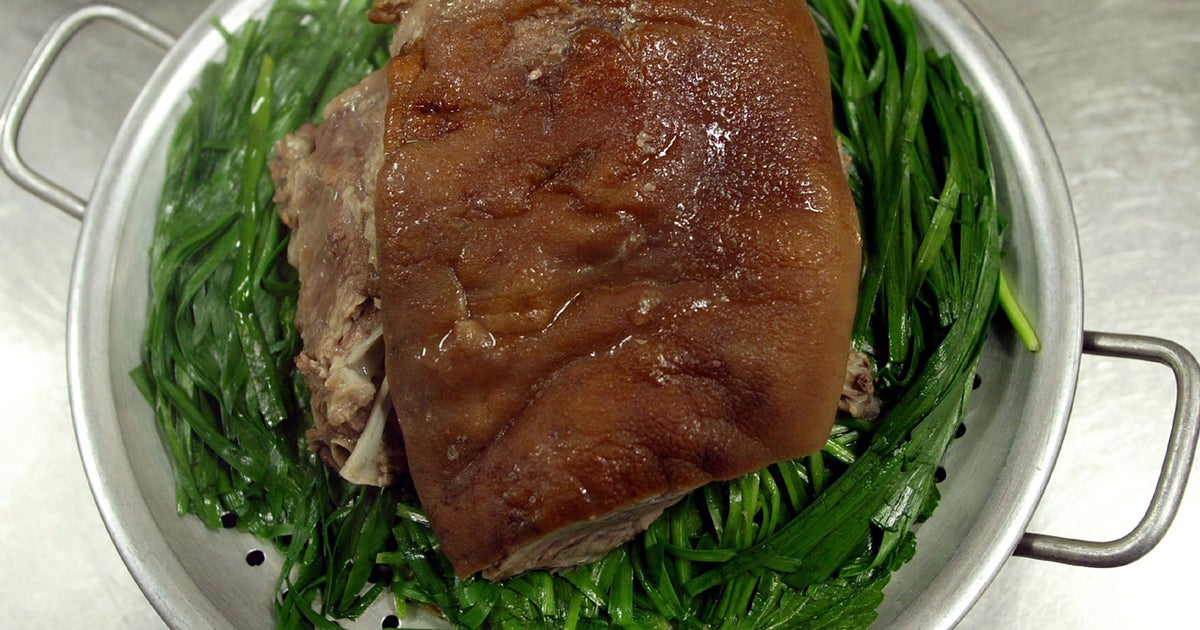 South Koreans dine on dog meat to beat heat wave - CBS News