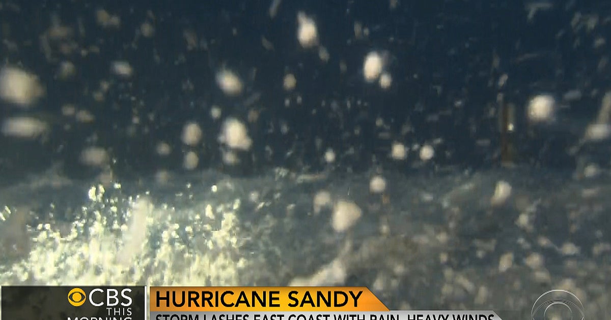 Watch: "Rogue wave" tops sand berm in Md. - CBS News