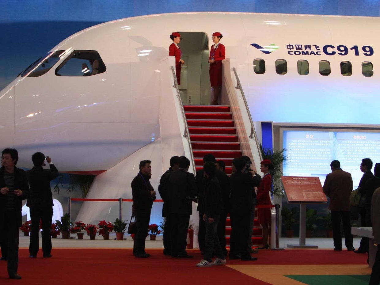 First made-in-China jetliner makes debut commercial flight - CBS News
