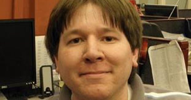 Journalist charged in hacking conspiracy suspended - CBS News