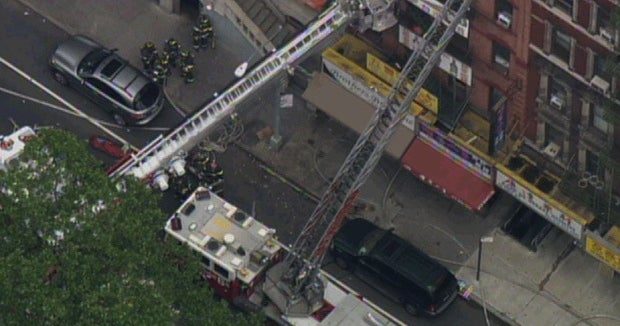 12 injured in NYC building explosion - CBS News