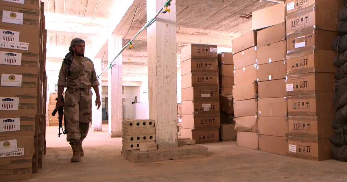 A rare glimpse of a Syrian rebel weapons storehouse - CBS News