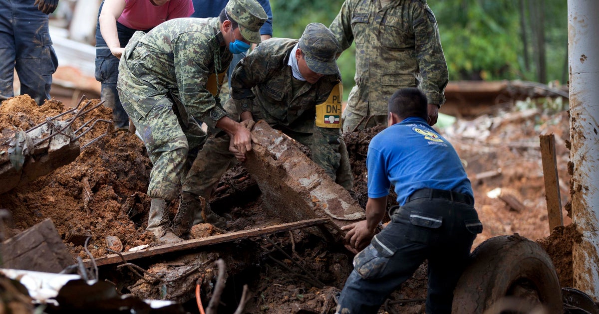 Teams dig in mud, rain for dead in Mexico slide - CBS News