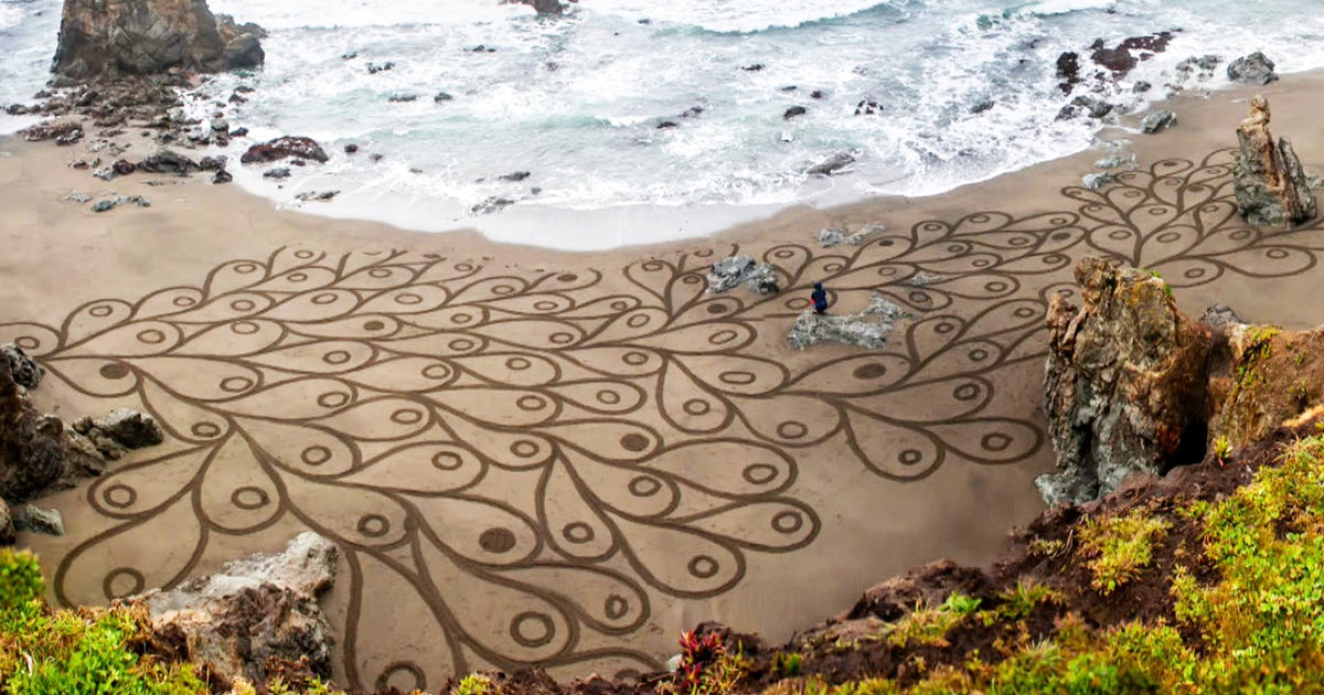 Artist makes a living playing in the sand - CBS News