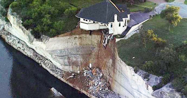 Luxury home dangles off cliff over Texas lake - CBS News
