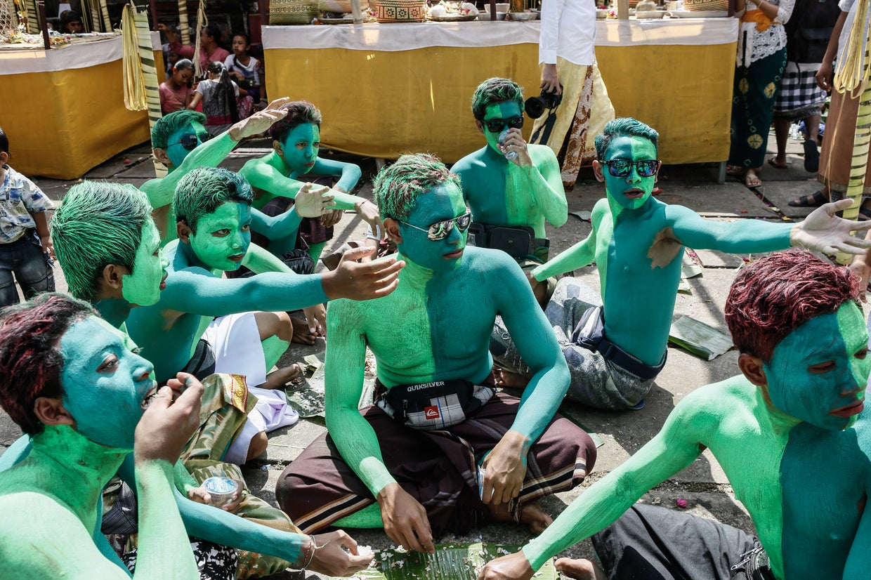 Painted parade wards off evil in Bali