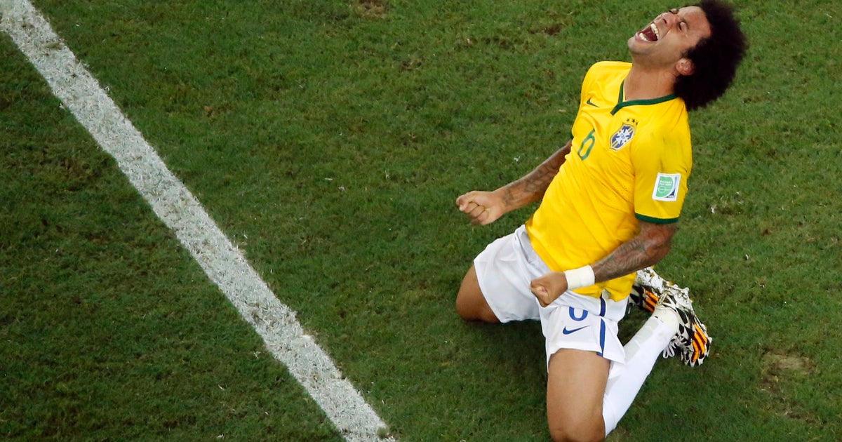 Home team Brazil moves on in World Cup - CBS News
