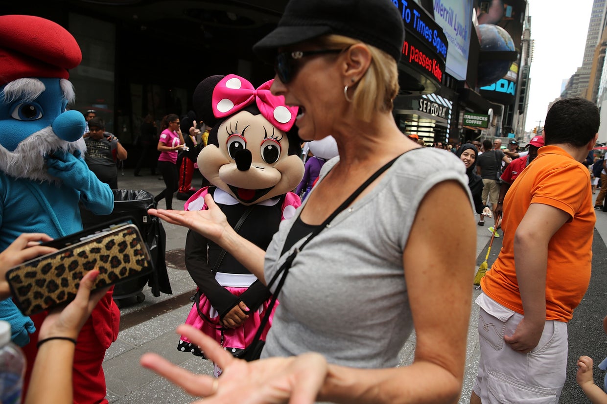 Costumed characters in New York City's Times Square raise questions