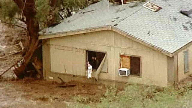 Residents, motorists stranded by raging floods in Arizona - CBS News