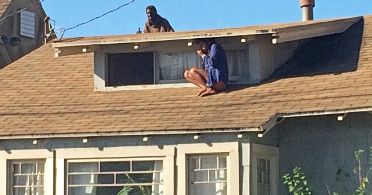 California woman evades home intruder by hiding on roof - CBS News