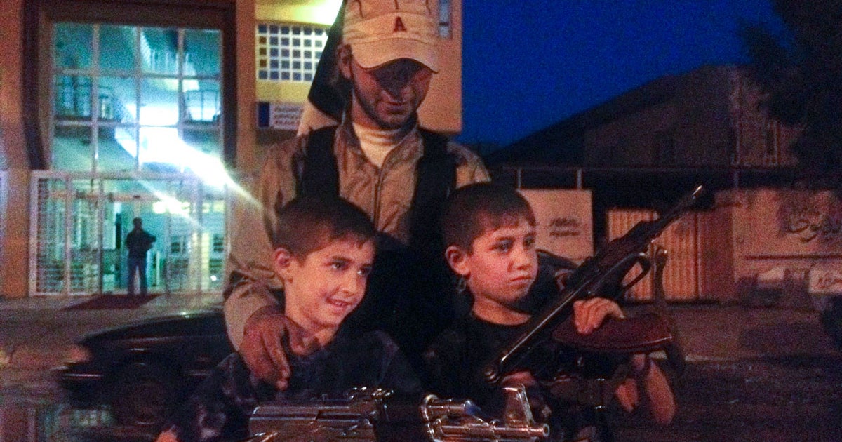 Child soldiers become integral part of ISIS' army - CBS News