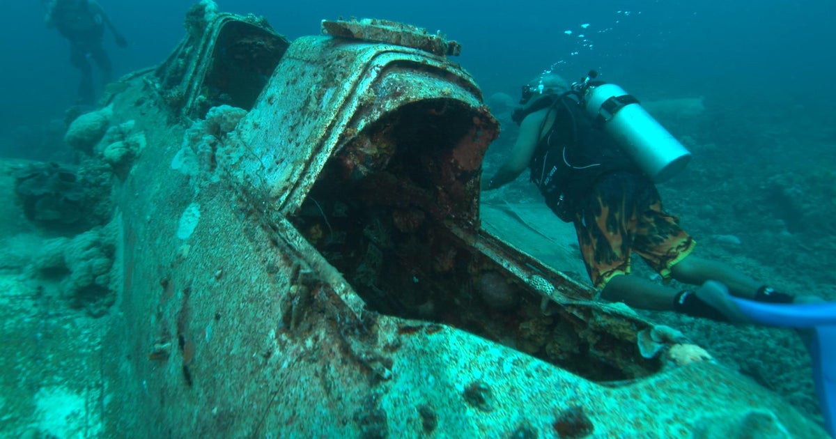 Diving deep for the forgotten - CBS News