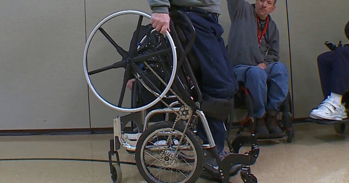 VA doctor engineers improved standing wheelchair - CBS News