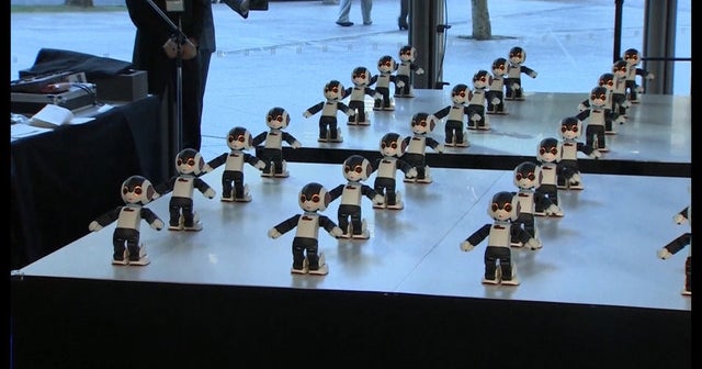 See 100 mini robots dancing in unison - CBS News