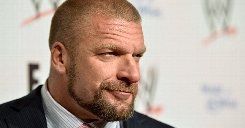 Triple H breaks character to console crying fan - CBS News