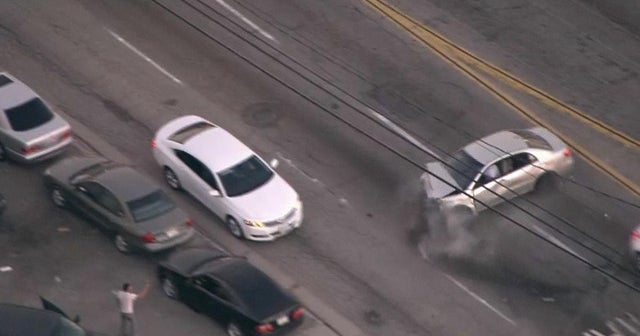 Armed man leads L.A. police on violent car chase - CBS News