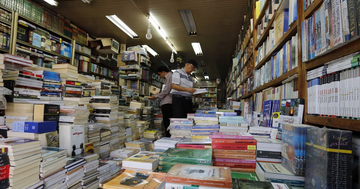 ISIS reportedly burning books looted from Mosul library in Iraq - CBS News