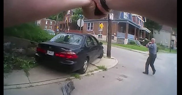 Officer charged as body cam video shows traffic stop shooting - CBS News