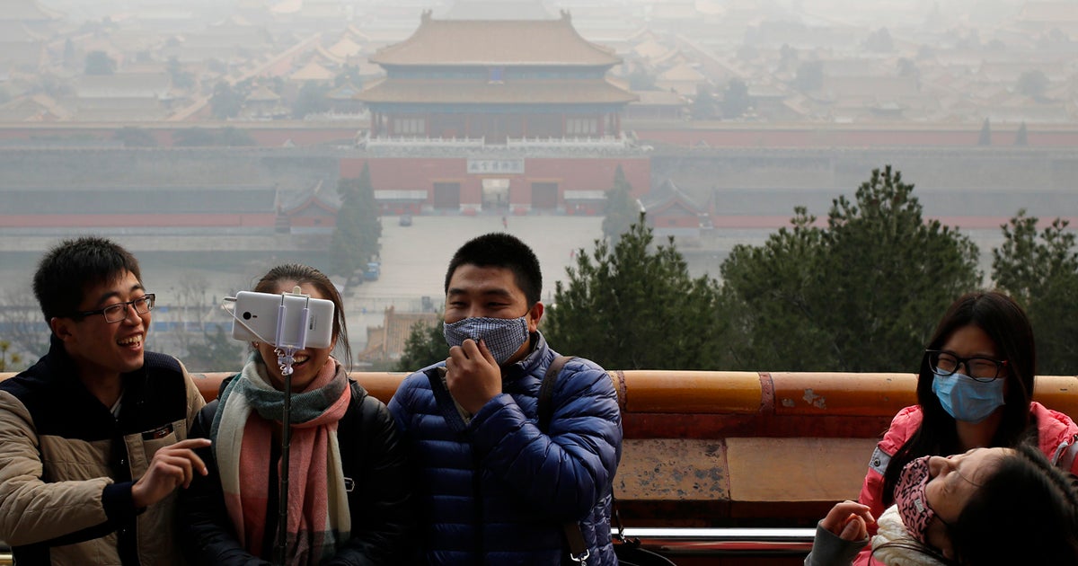 Beijing issues first-ever red alert for smog - CBS News
