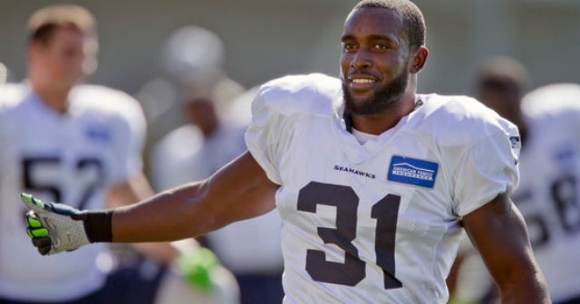 Police called on NFL player Kam Chancellor, who looked into gym - CBS News