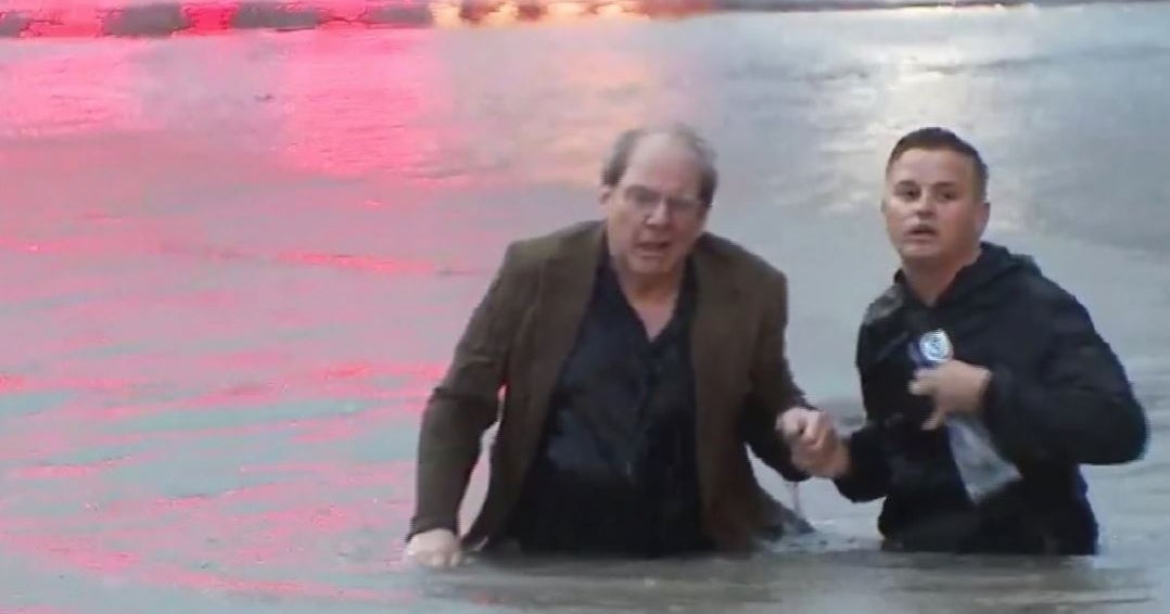 TV reporter helps in rescue amid Houston flooding - CBS News