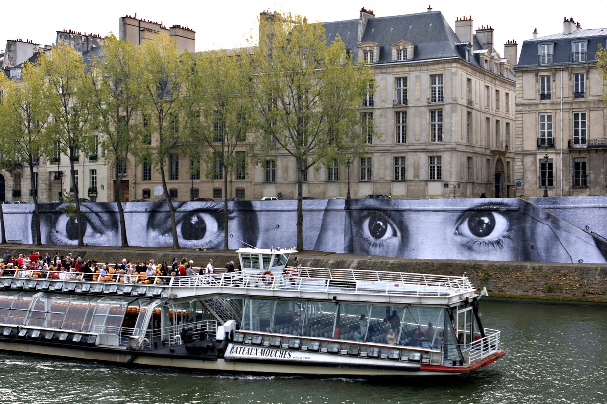 French street artist JR makes the Louvre Pyramid disappear