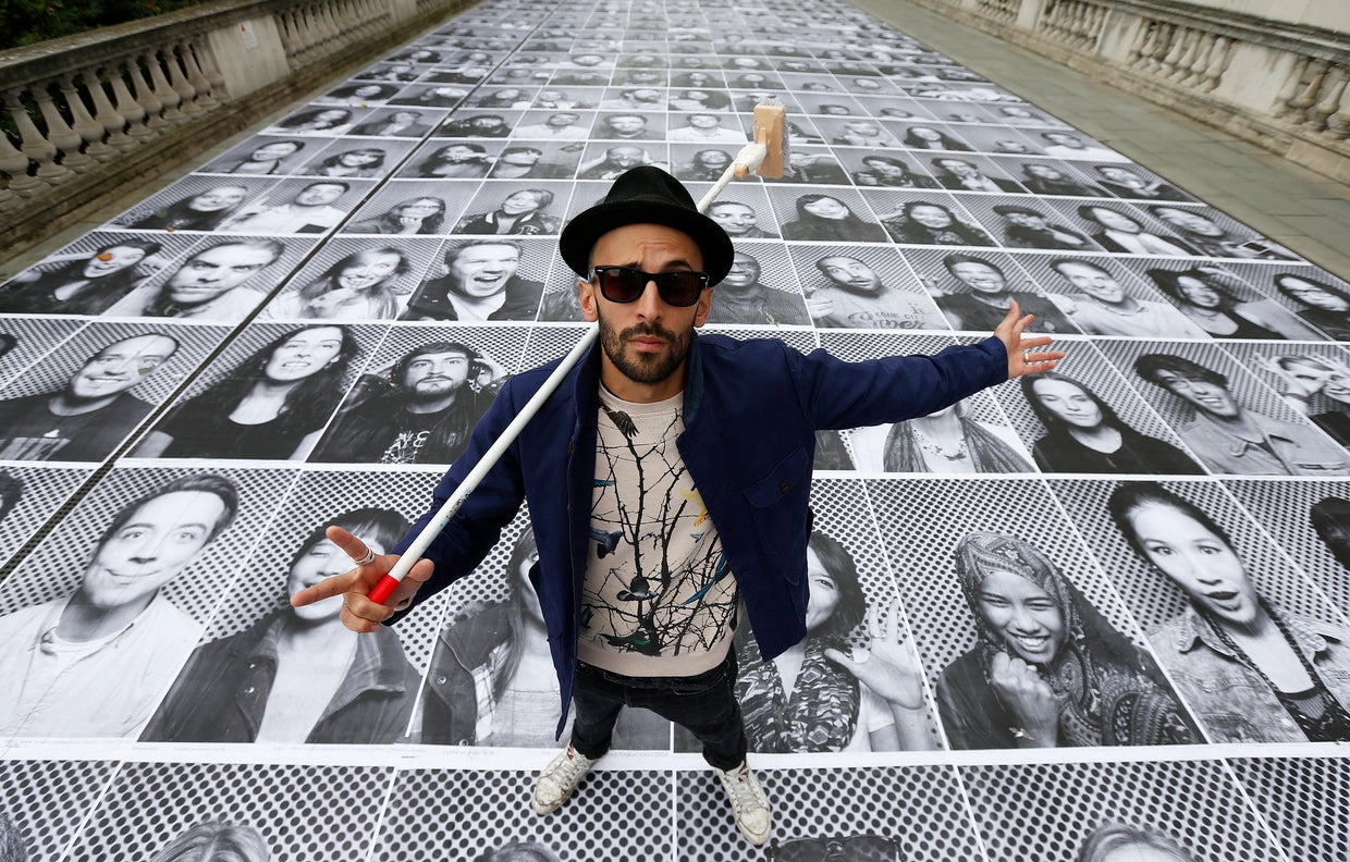French street artist JR makes the Louvre Pyramid disappear