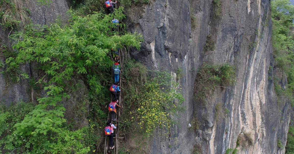 Chinese kids had to scale a cliff with a bamboo ladder in Atuleer in ...