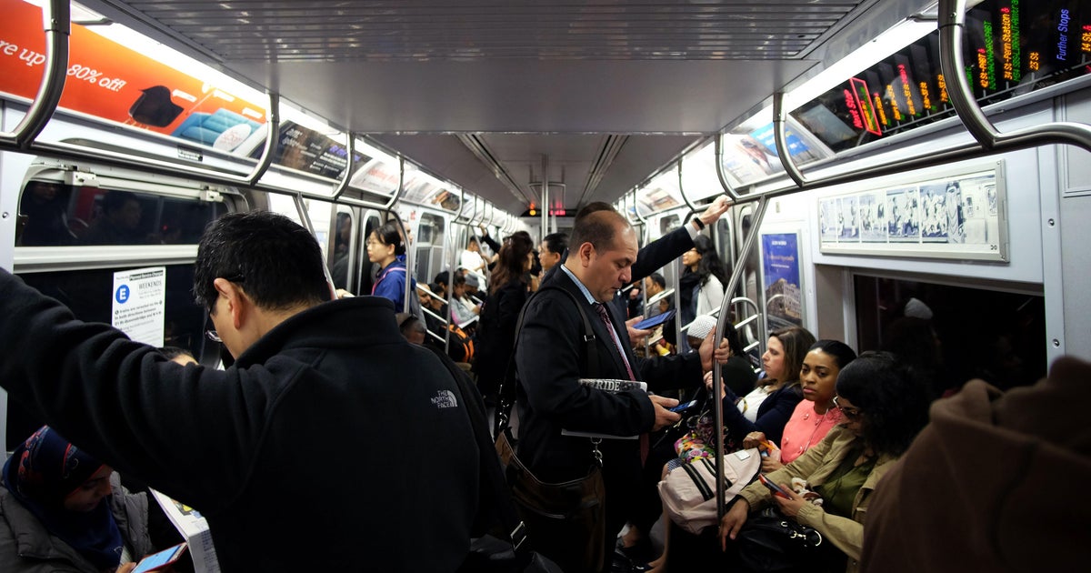 Woman causes chaos on New York subway with box of crickets, worms - CBS News