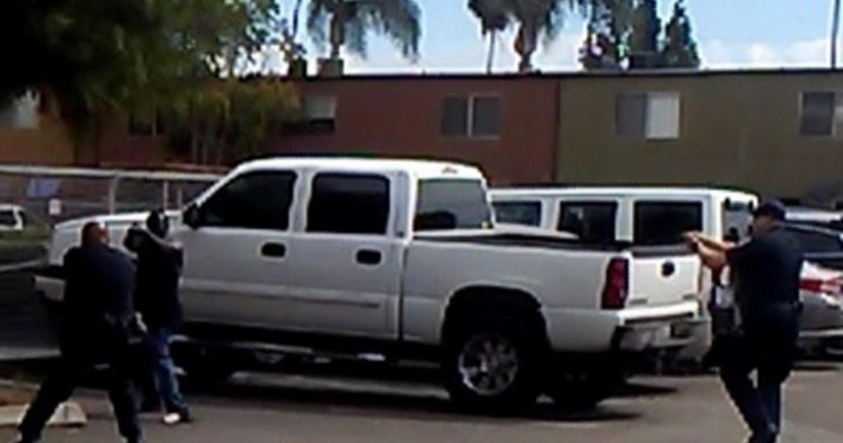 Angry crowd gathers at scene of SoCal police shooting - CBS News