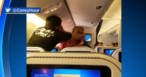 Passengers fight on flight from Japan before takeoff - CBS News
