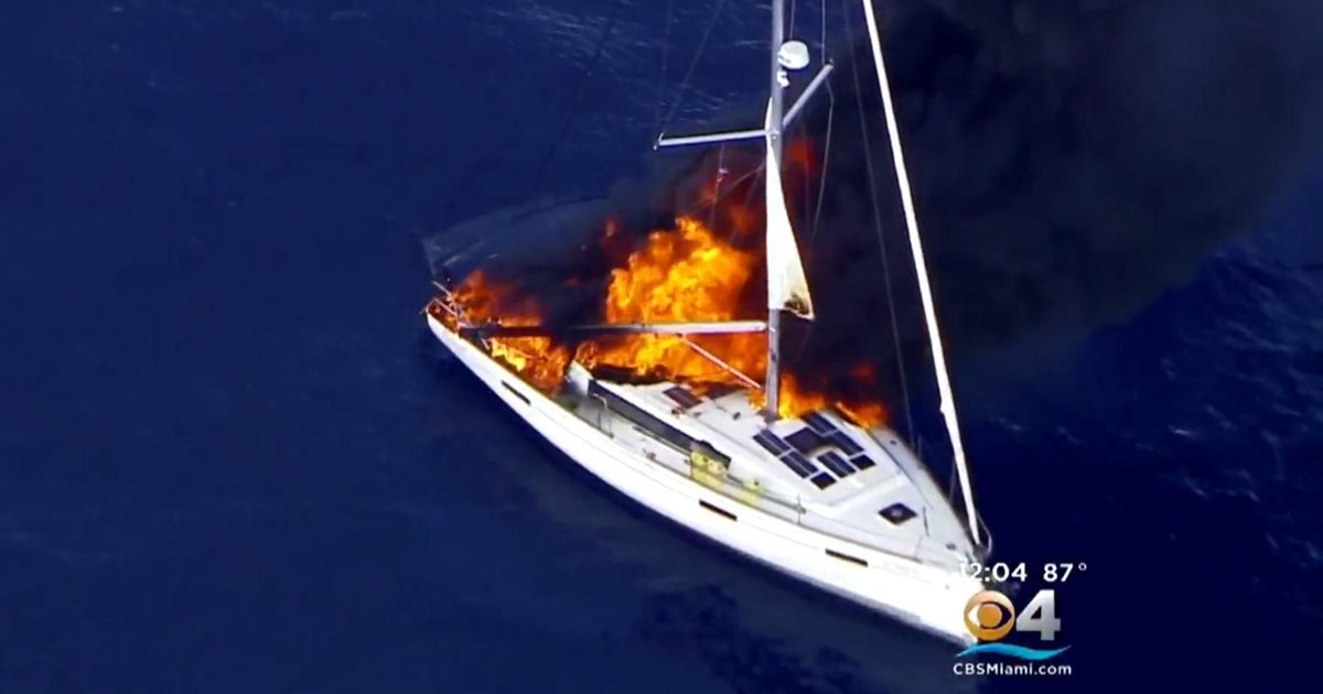 Man rescued from sailboat engulfed in flames off Florida beach - CBS News