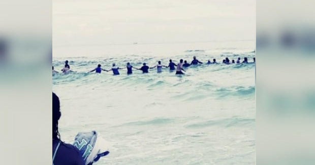 Dozens of strangers form human chain to rescue swimmers at Florida ...