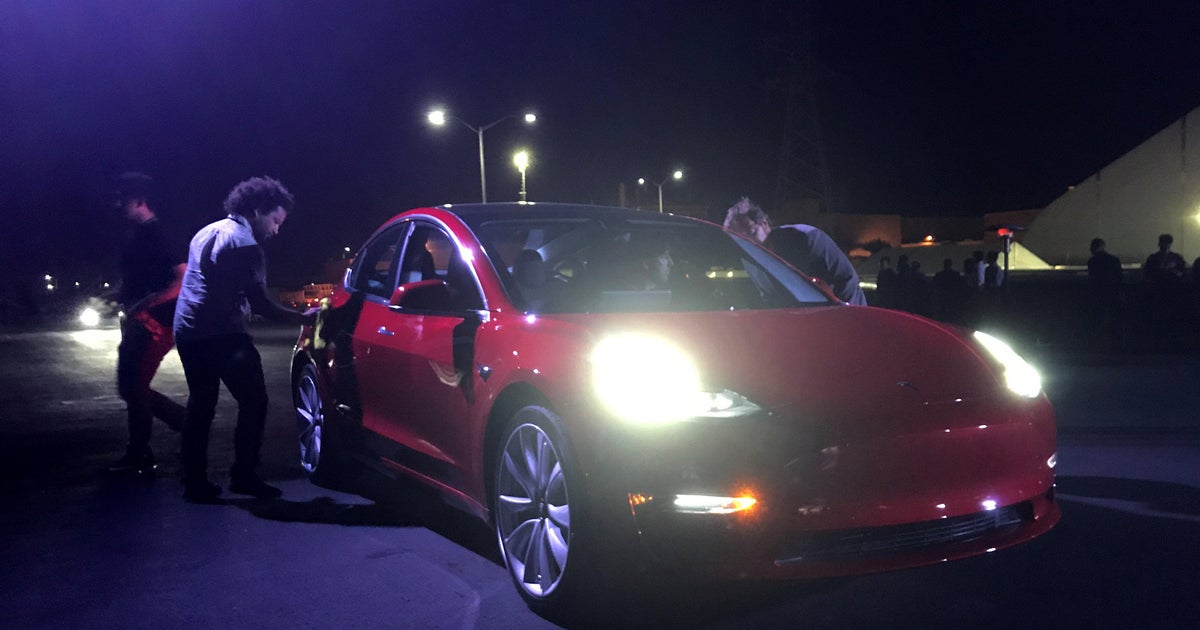 Tesla delivers the first Model 3 sedans - CBS News
