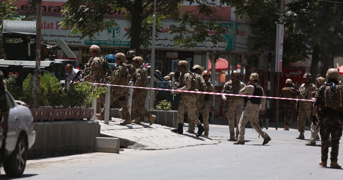Explosions and gunfire in central Kabul attack near Iraqi embassy - CBS ...