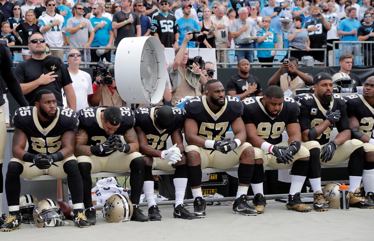 NFL players kneel, raise fists, lock arms during national anthem - CBS News